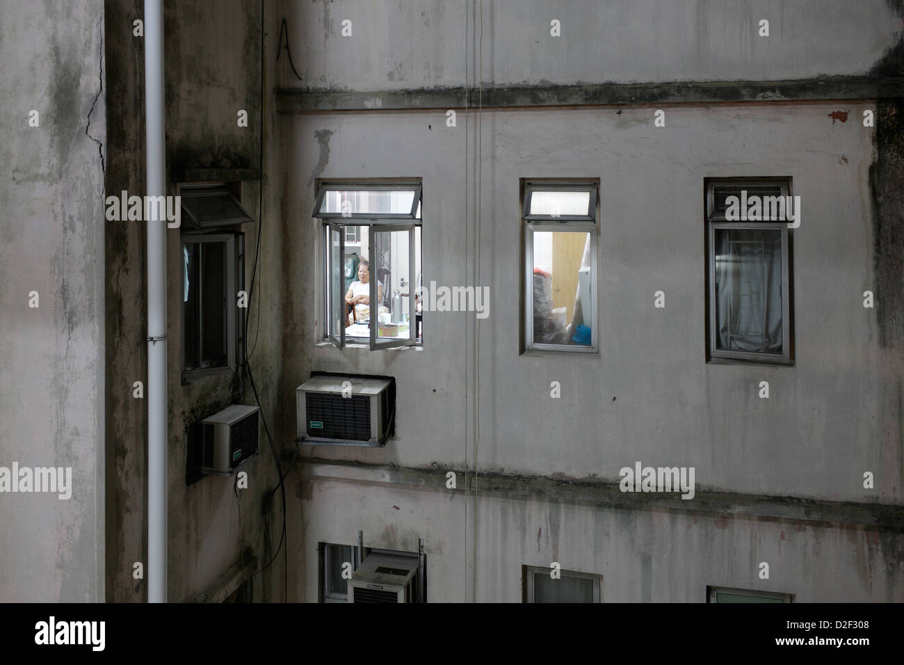 Hong Kong, China, lit window in the backyard of a rundown house Stock ...