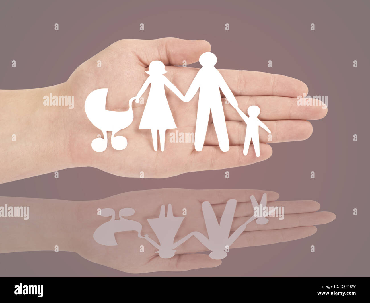 Paper family in hands Stock Photo - Alamy