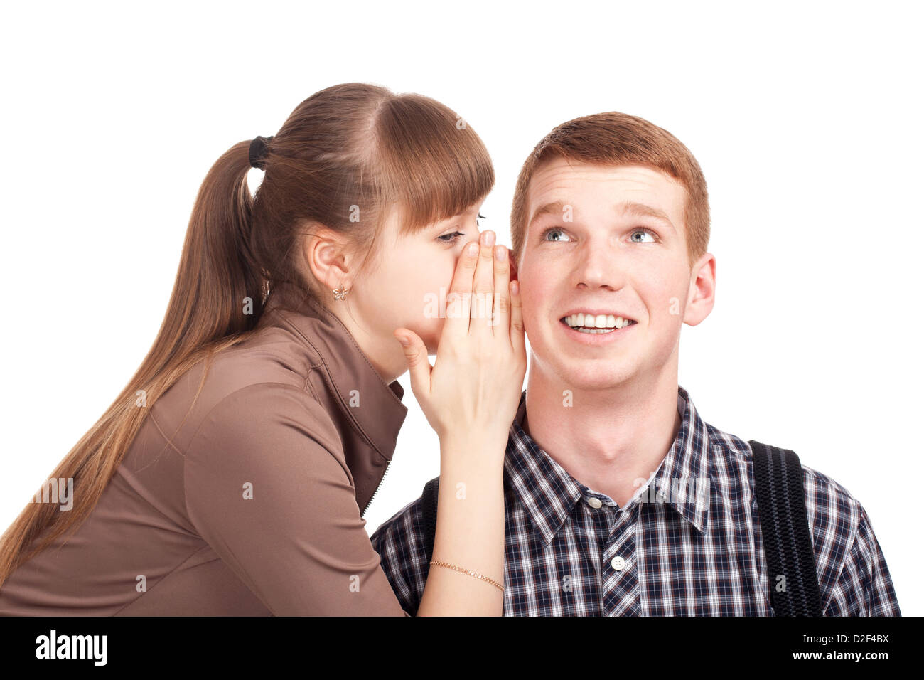Young woman telling a secret to a man Stock Photo - Alamy