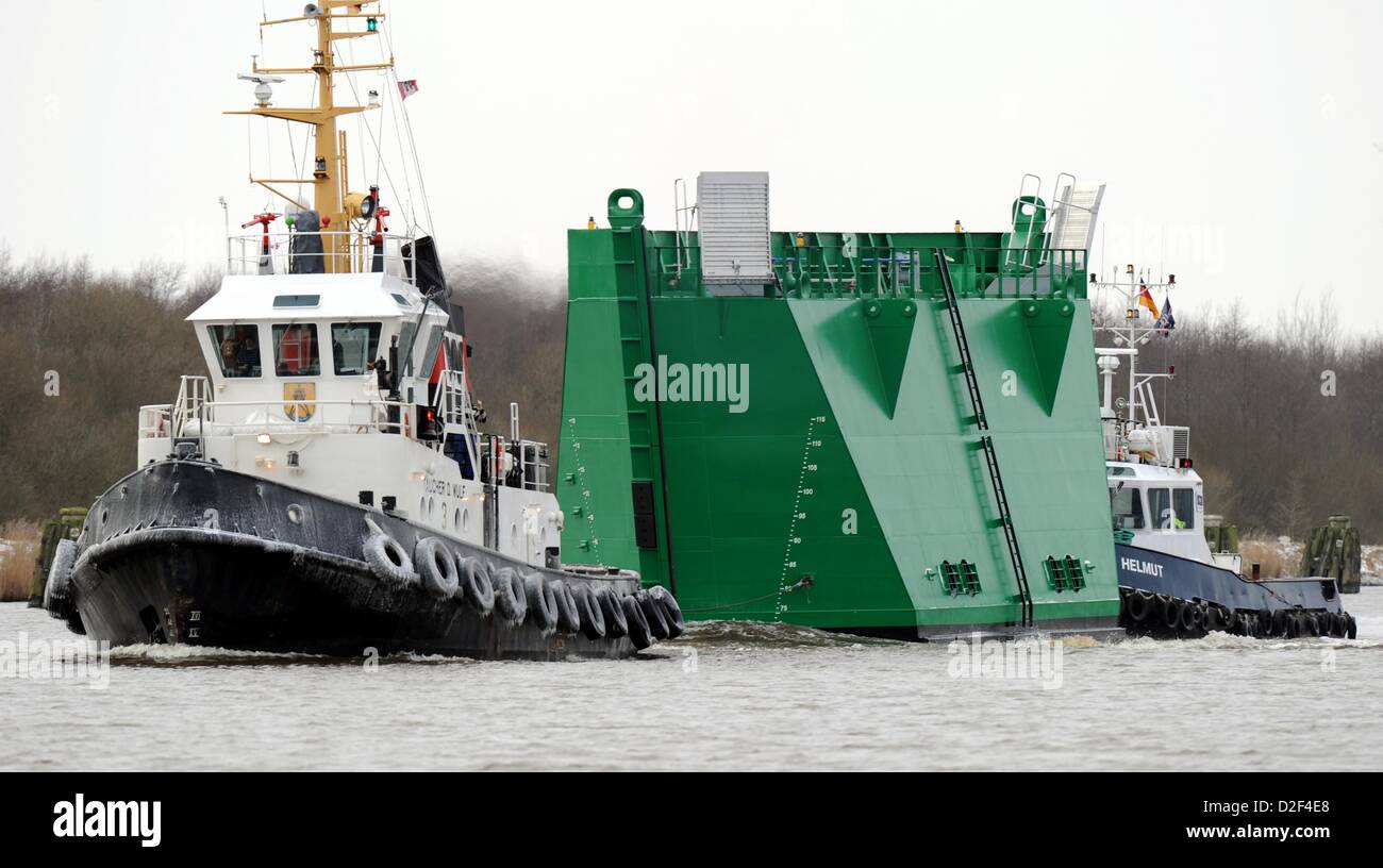 The floating lock gates are towed on the Kiel Canal towards Kiel by tug ...