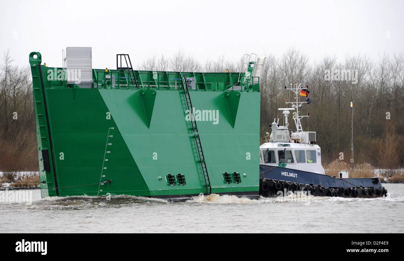 The floating lock gates are towed on the Kiel Canal towards Kiel by tug ...