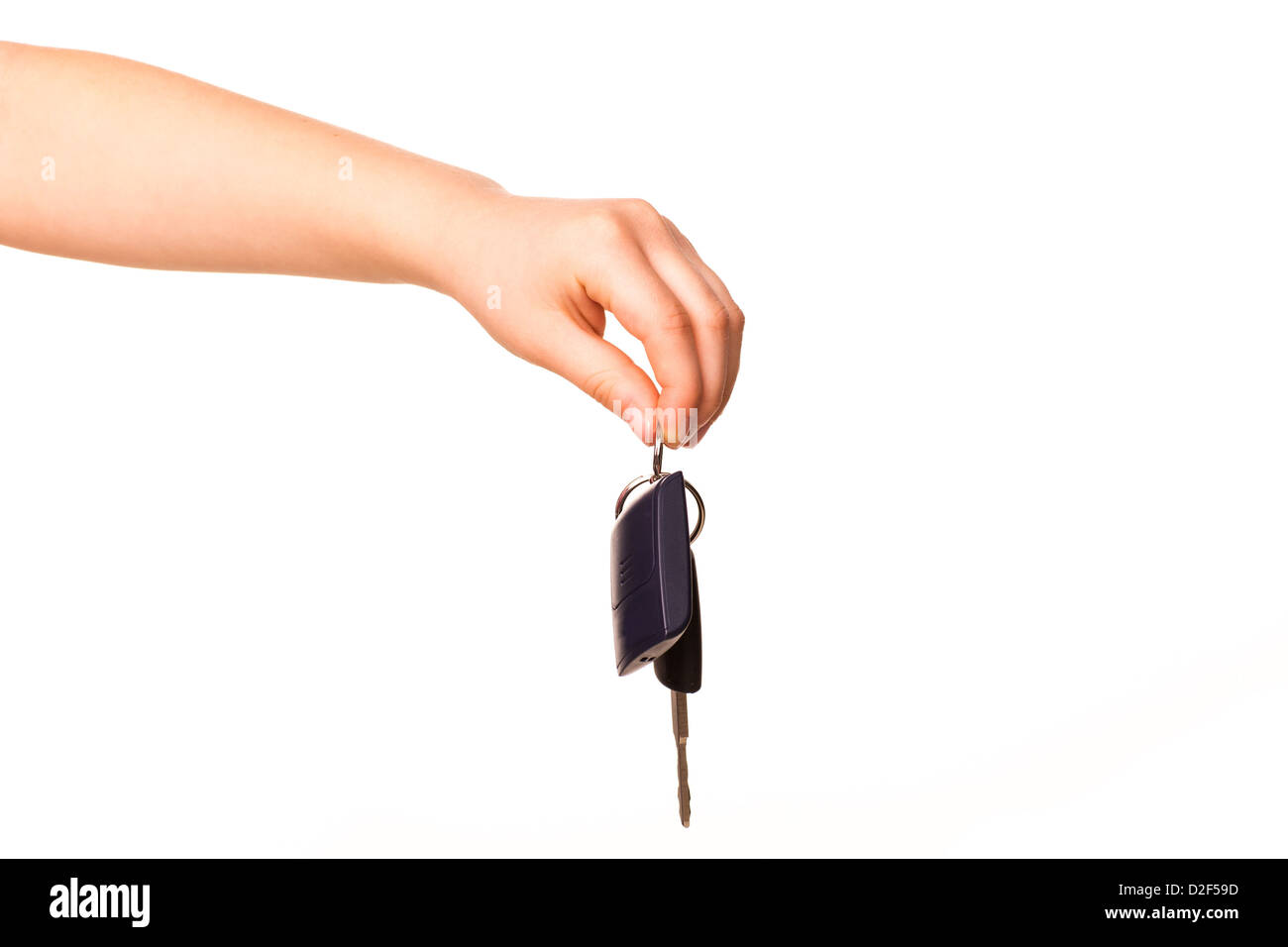 Male hand holding a car key isolated on white. New car concept Stock ...