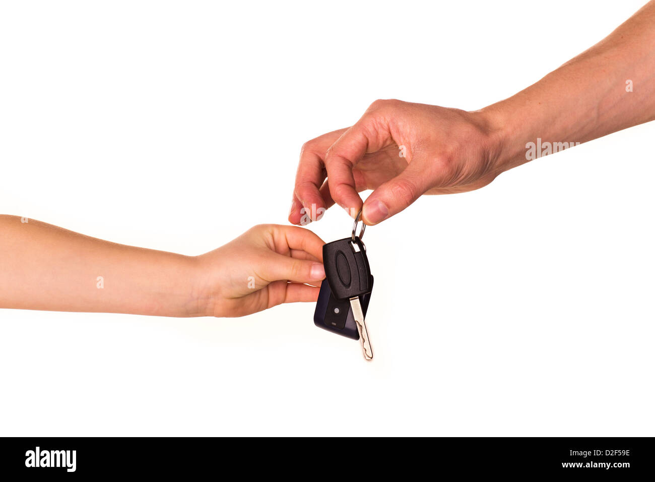 Male hand holding a car key and handing it over to another person ...