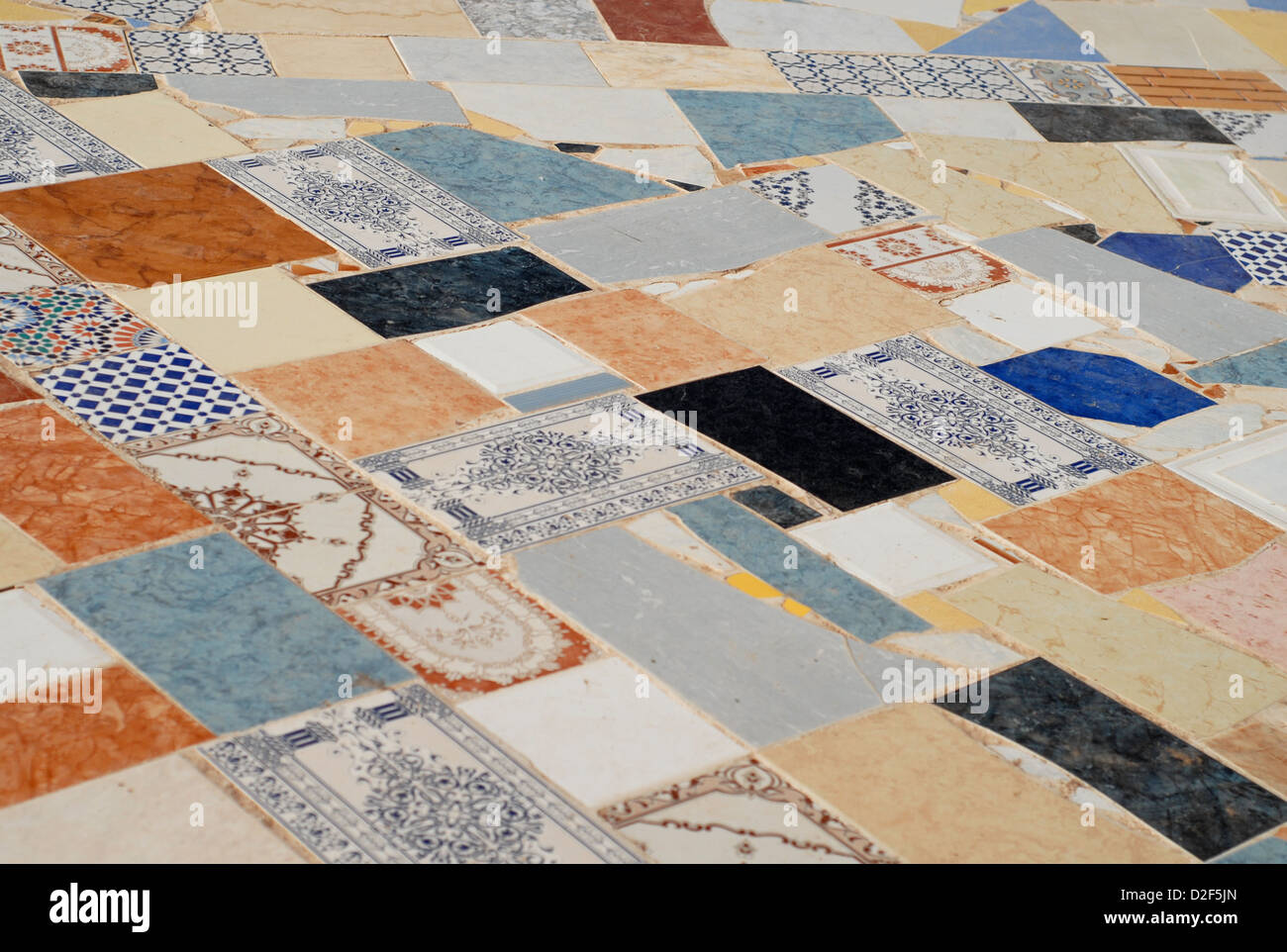 pavement made from assorted pieces of tile outside a tile sellers shop ...