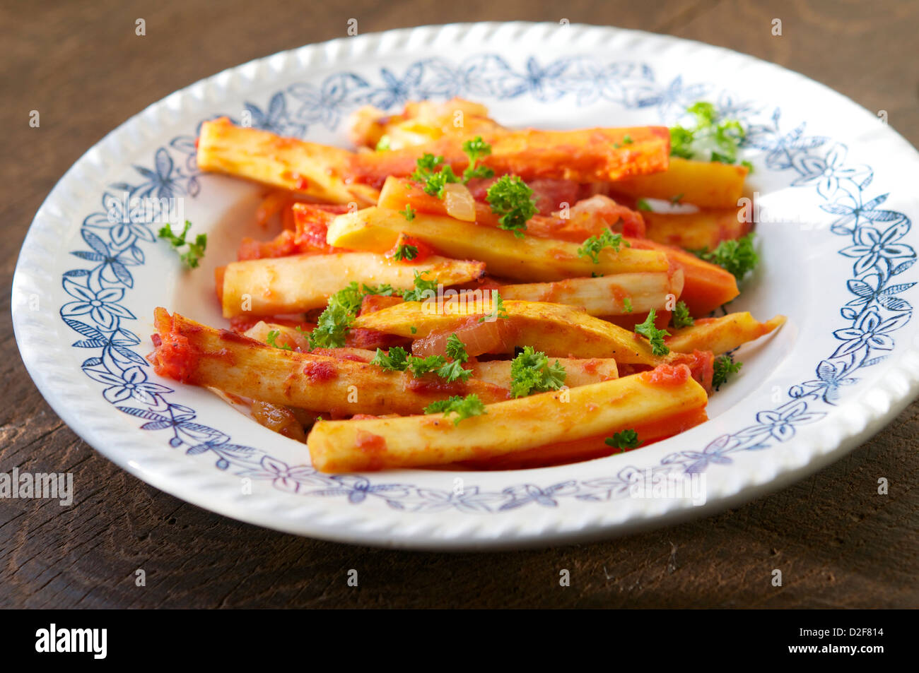 Bowl with a winter vegetables stew, featuring carrots, parsley root ...