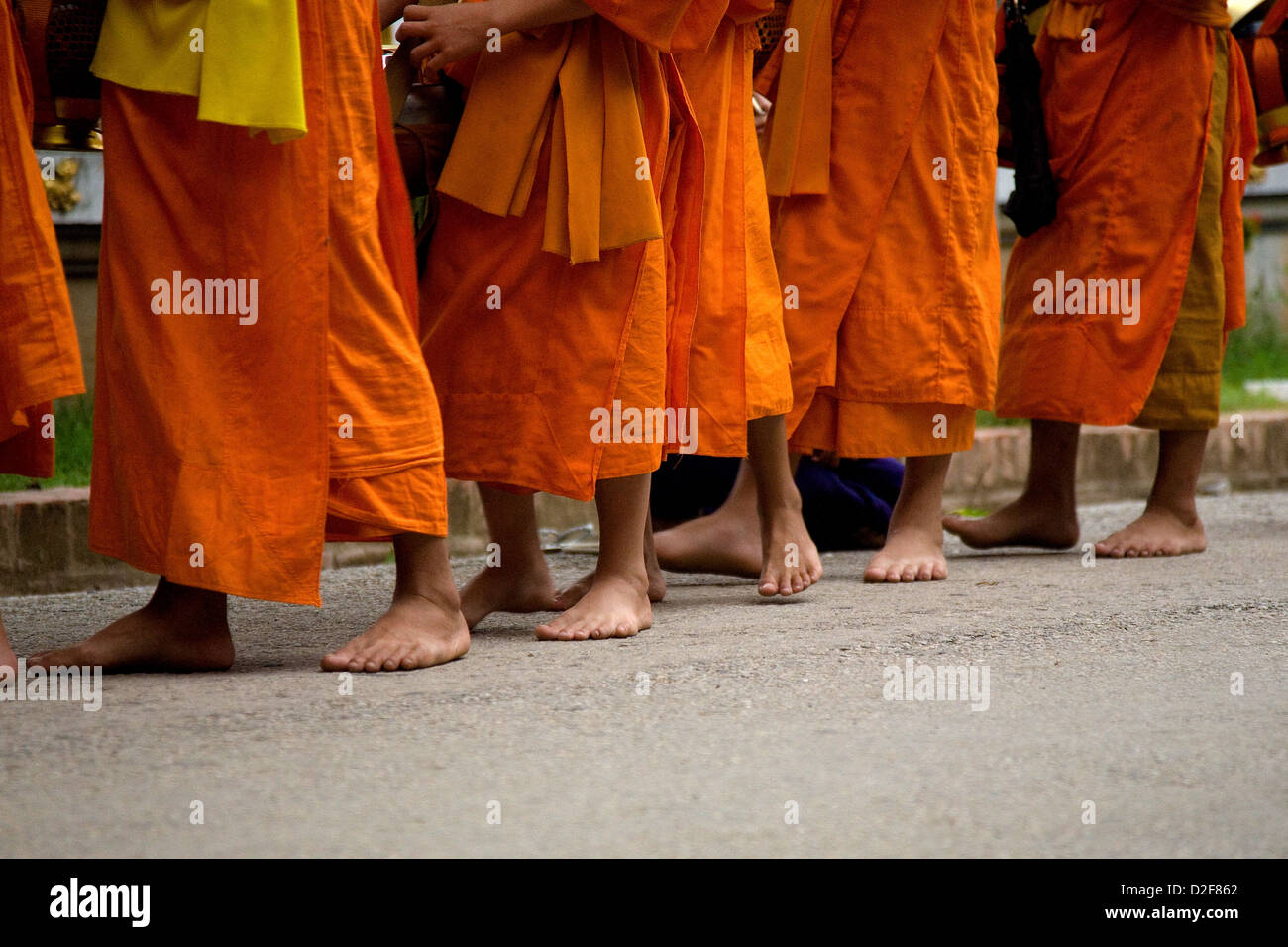 Monks receiving Alms in Luang Prabang, Laos. Close up of feet Stock ...