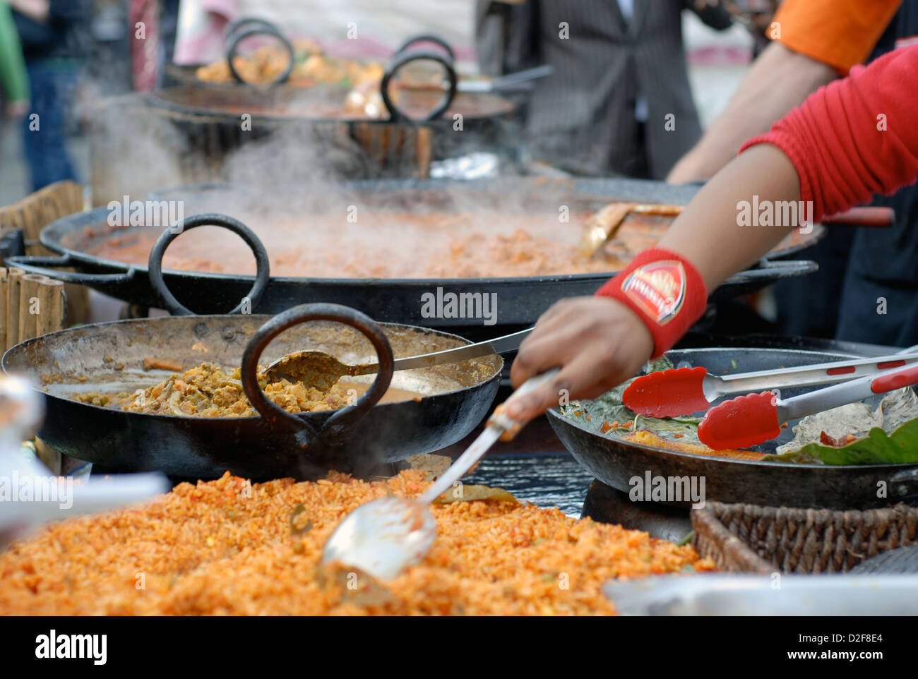 arsenal fan cooking food in camden lock market london Stock Photo - Alamy
