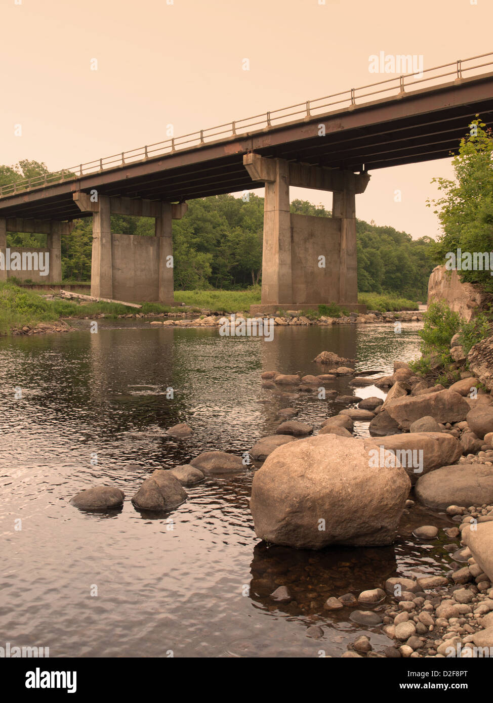 boulder and bridge on moose river in the Adirondack state park,New York ...