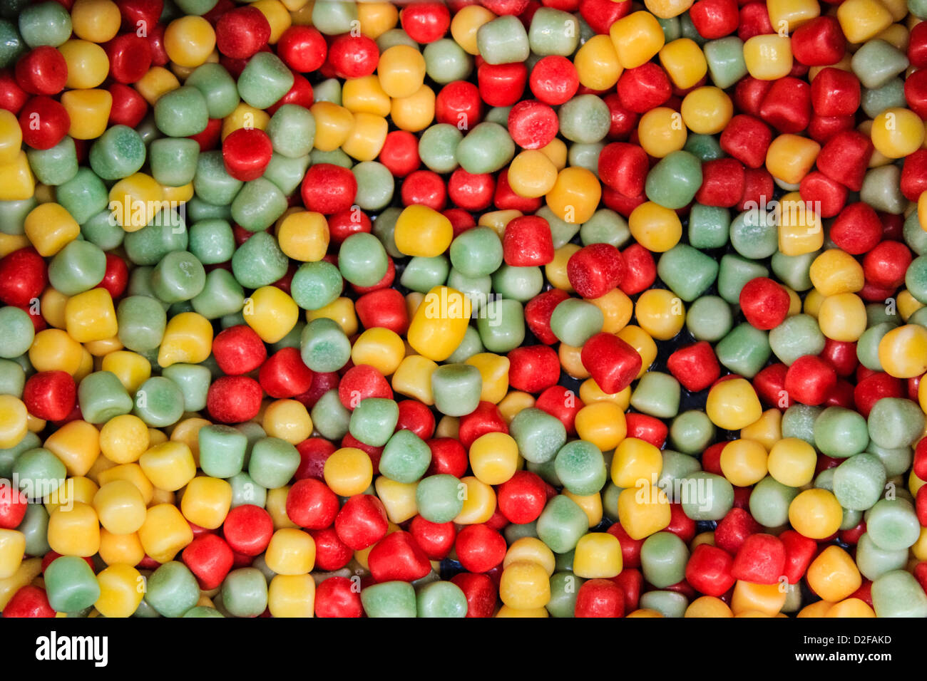 A box of colorful candy in green, red, and yellow Stock Photo - Alamy