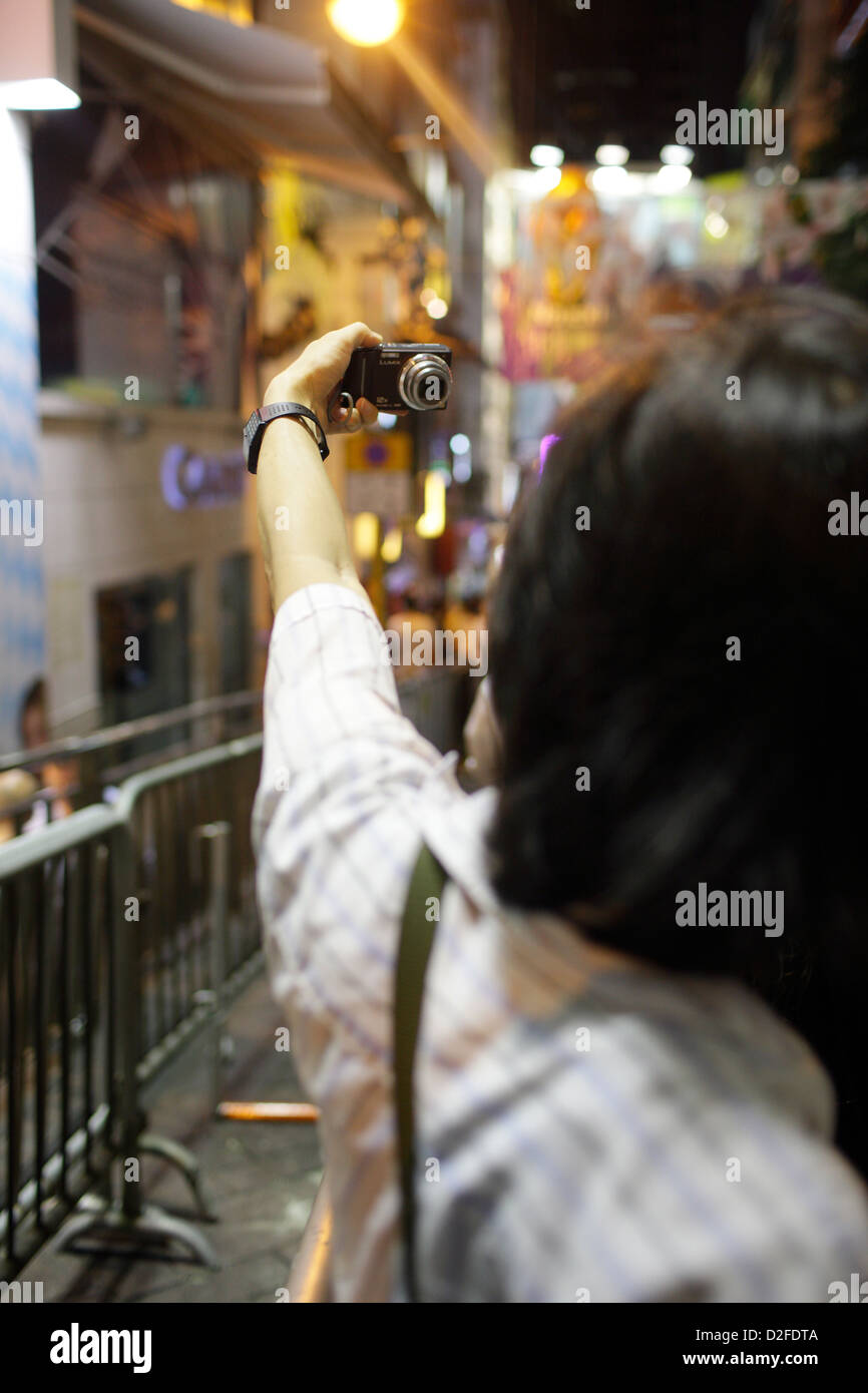 Hong Kong, China, a man photographed with a digital camera Stock Photo ...