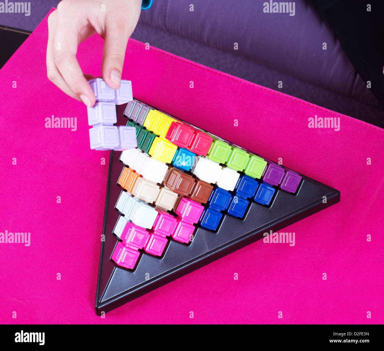 A hand to play with blocks game Stock Photo - Alamy