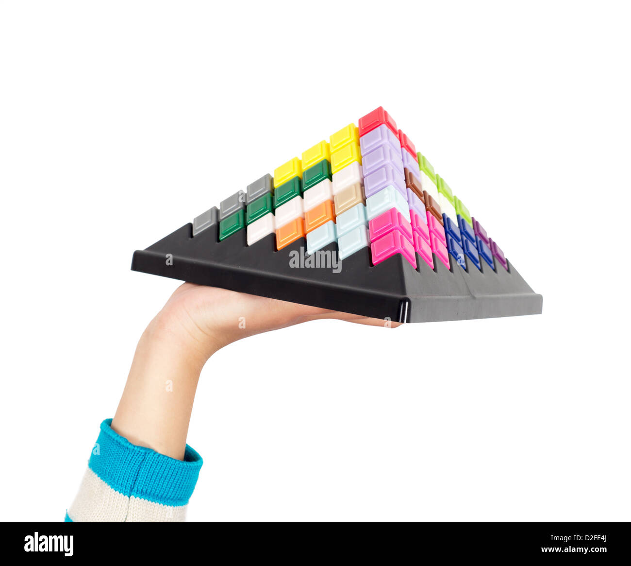 Woman hand holding a building block game disk Stock Photo - Alamy