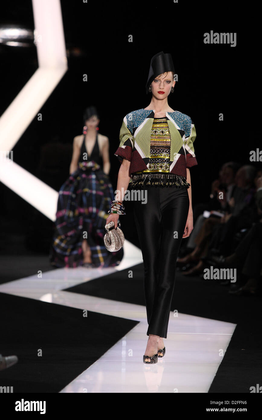 Models wear creations by Italian designer Giorgio Armani as part of the ...