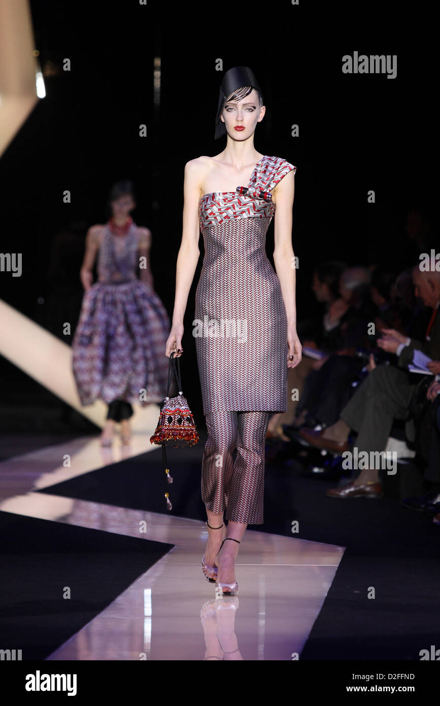 Models wear creations by Italian designer Giorgio Armani as part of the ...