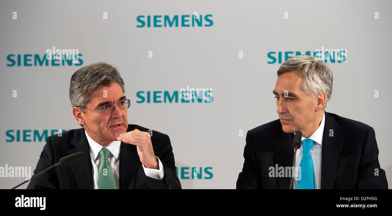 CFO of Seimens Joe Kaeser (L) and CEO of Siemens Peter Loescher stand ...