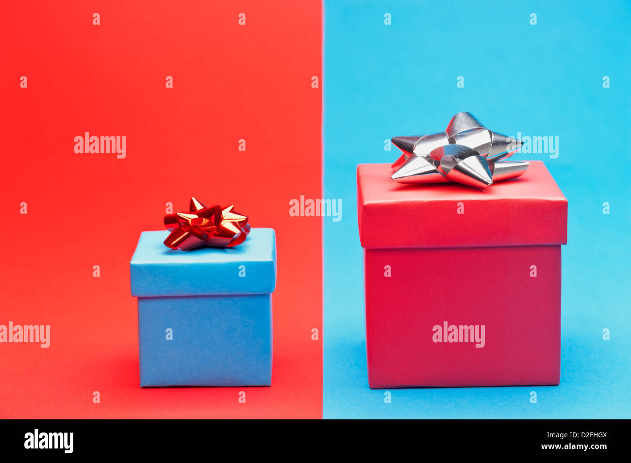 A red and blue present in front of a red blue background Stock Photo ...