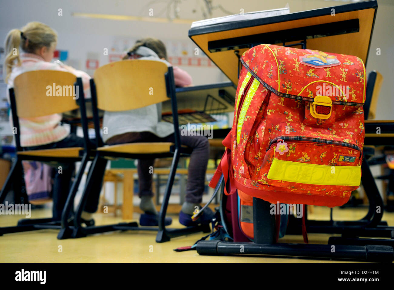 A backpack hangs under a desk at an inclusive community primary school ...