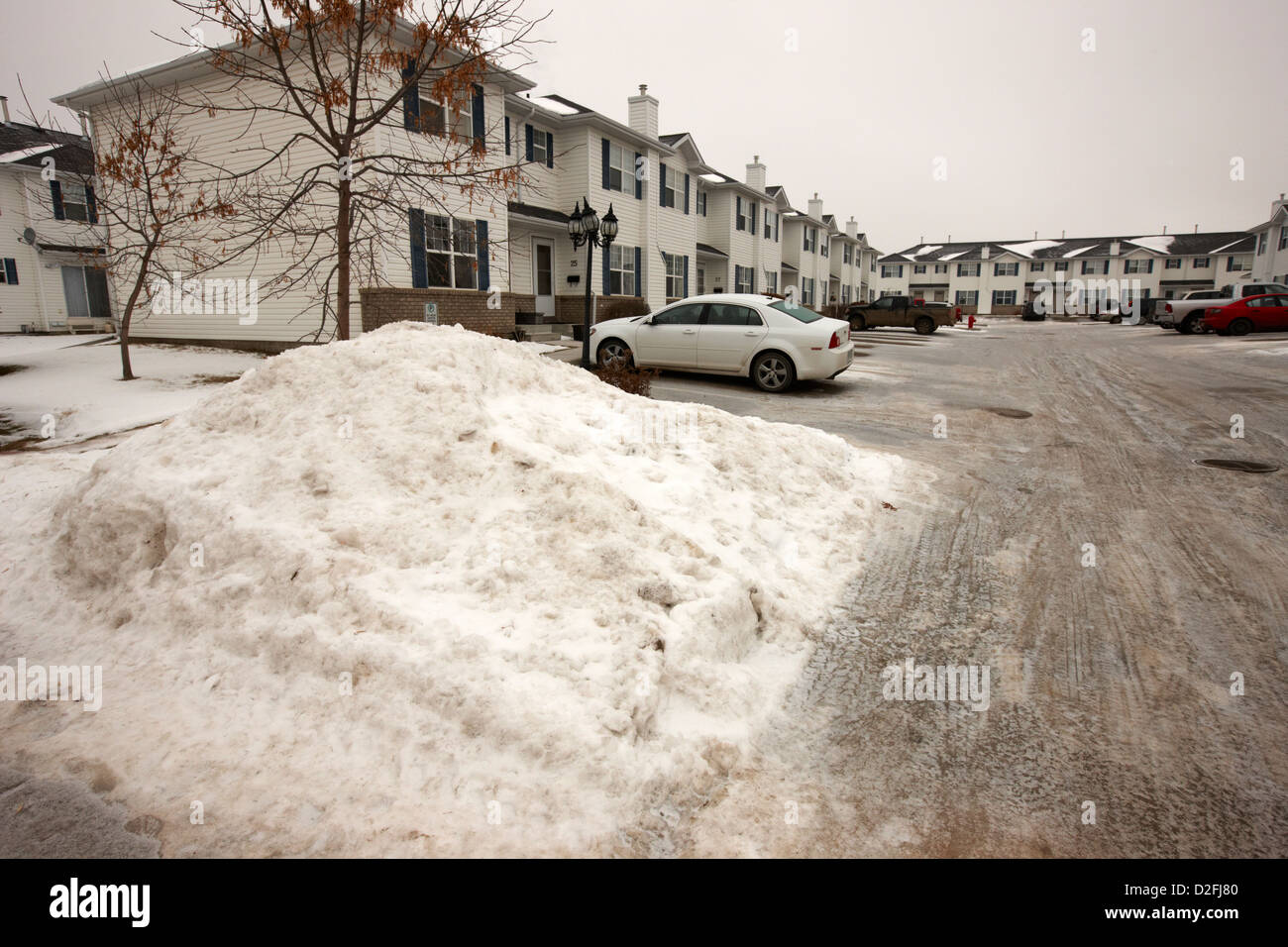 large piles of snow piled up for removal from residential area ...