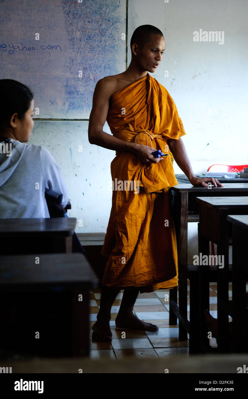 a monk teaching in a classroom Stock Photo - Alamy