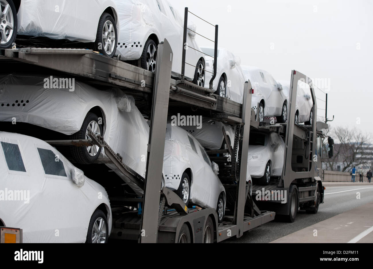 New vehicles in protection foil on a car transporter leave the VW ...