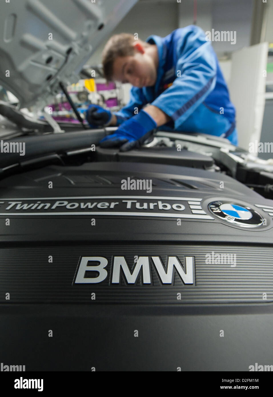 An employee is working on the engine of the new BMW 3 series on ...