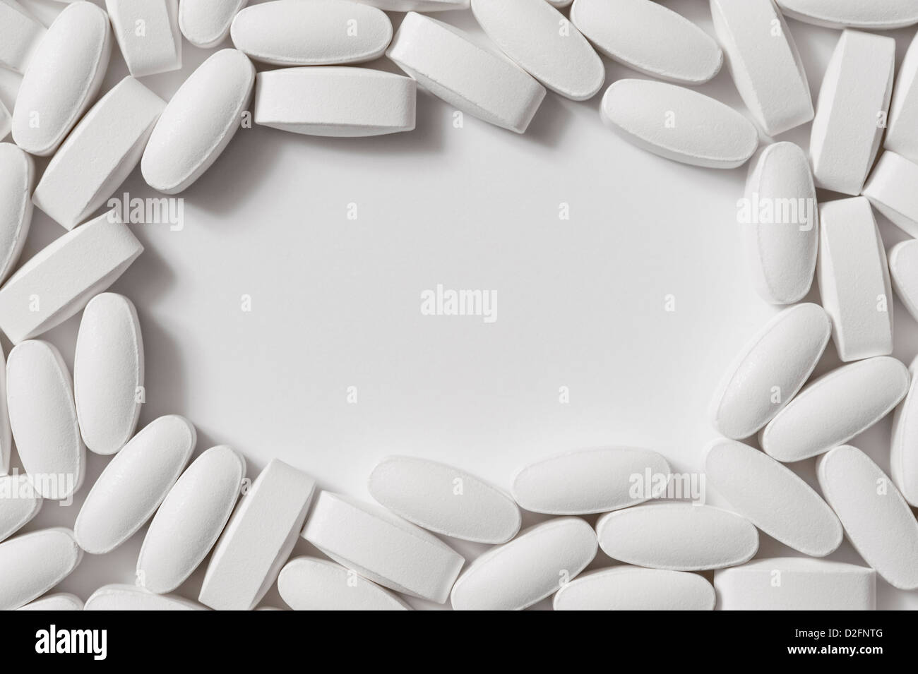 Generic white pills on a white background with a space for copy Stock ...