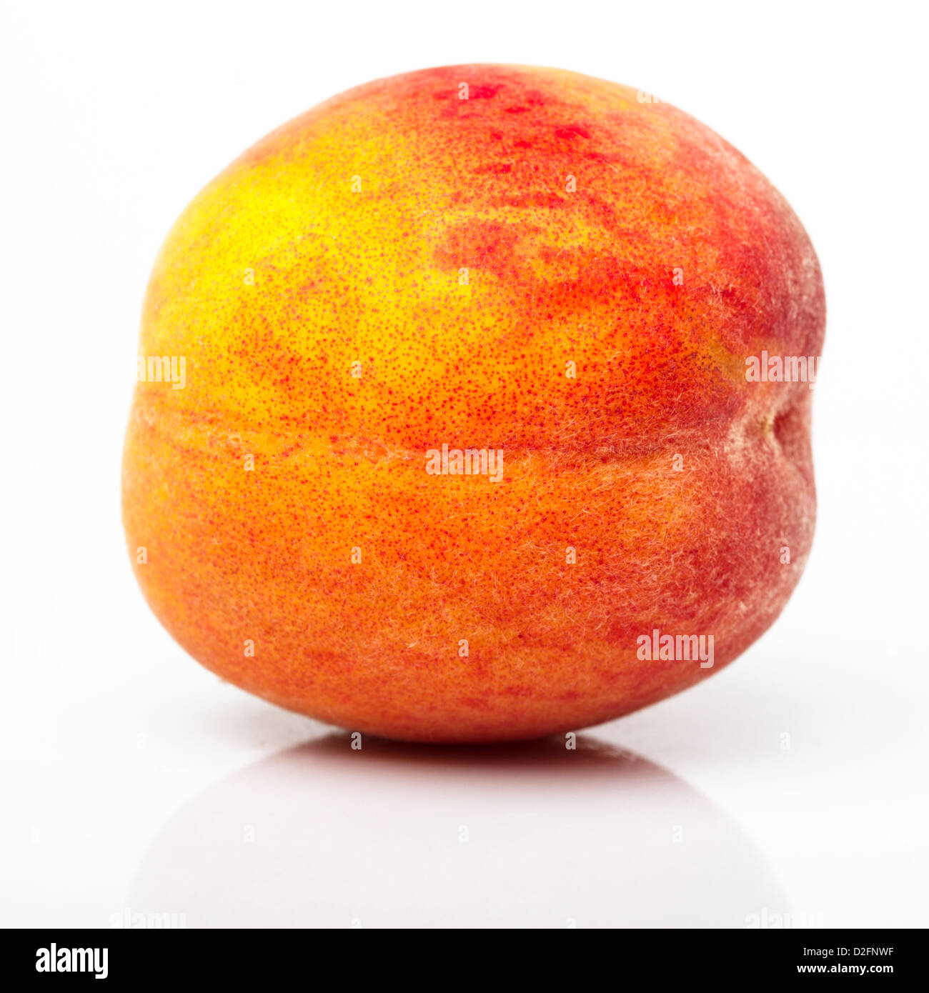 One peach closeup isolated on white background Stock Photo - Alamy