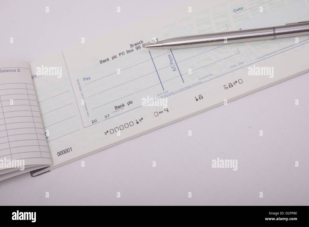 Check book and pen Stock Photo - Alamy