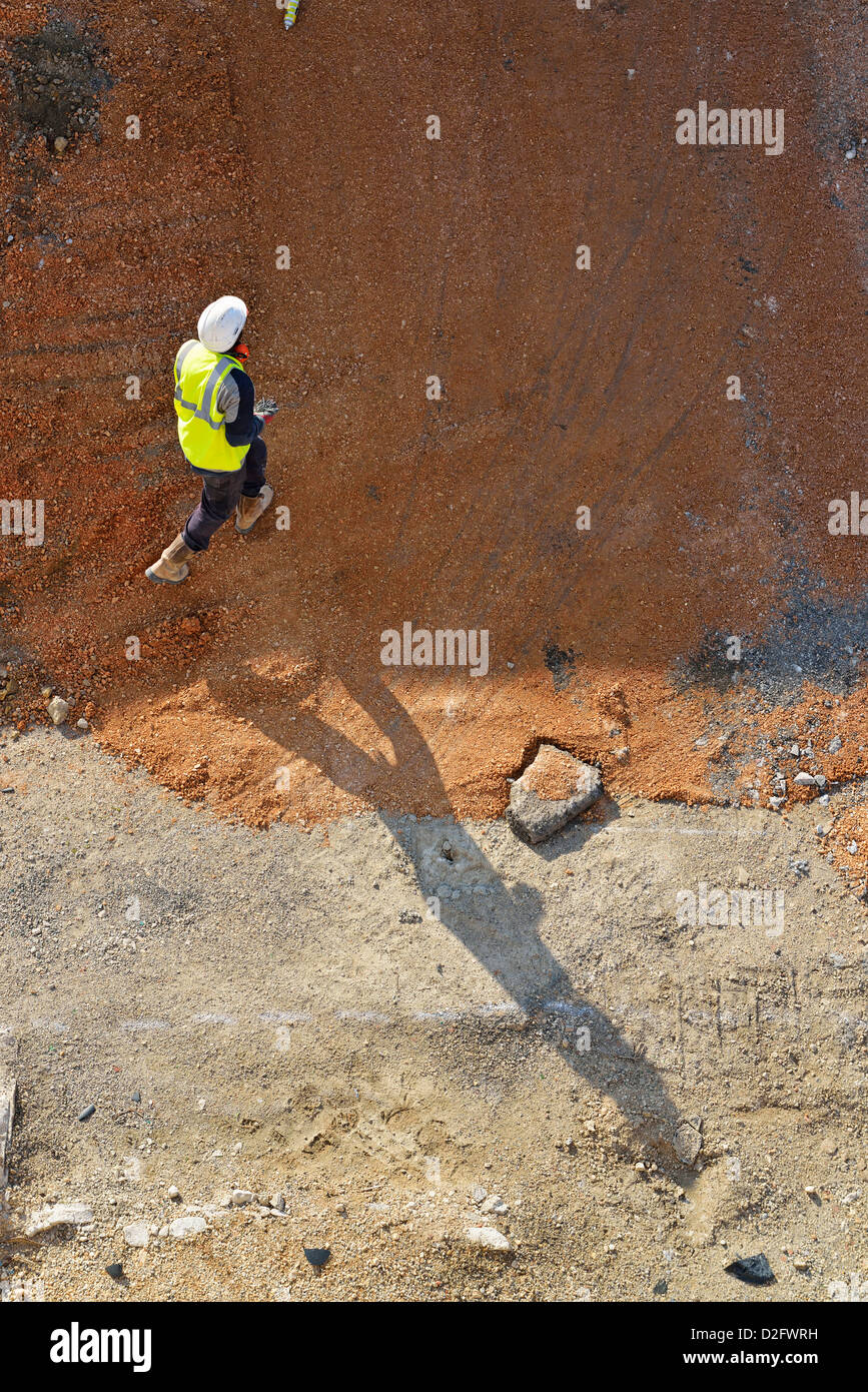 Construction workers - Building construction worker walking across an ...