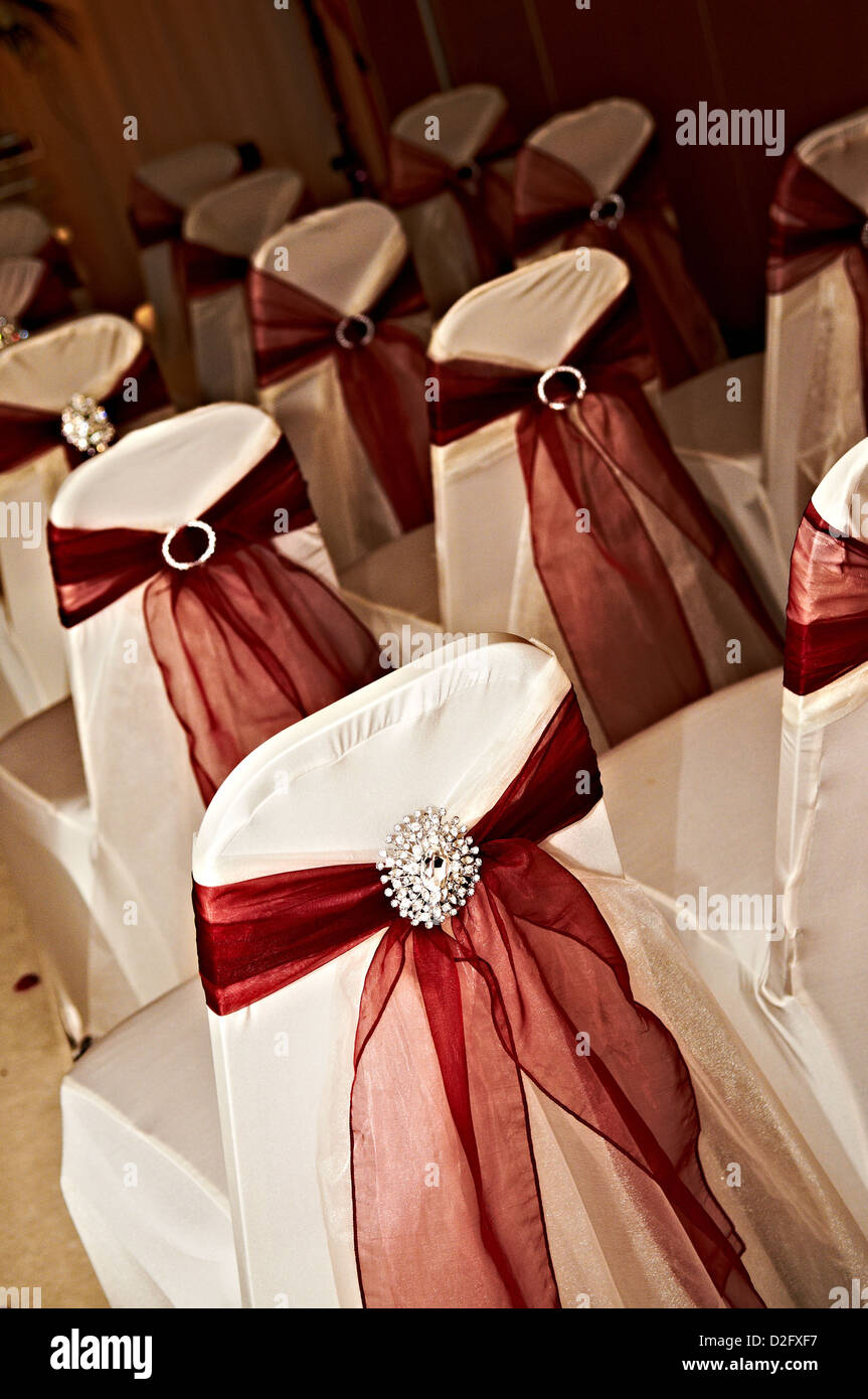 Decorated chairs at a wedding Stock Photo - Alamy