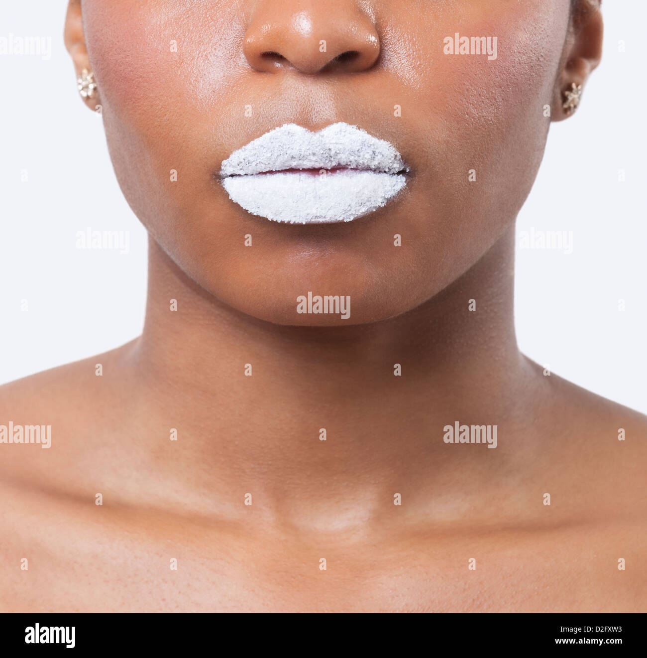 Close-up shot of young African American woman with white lips over ...
