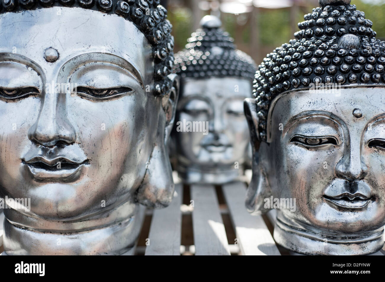 Silver Buddha Heads Stock Photo - Alamy