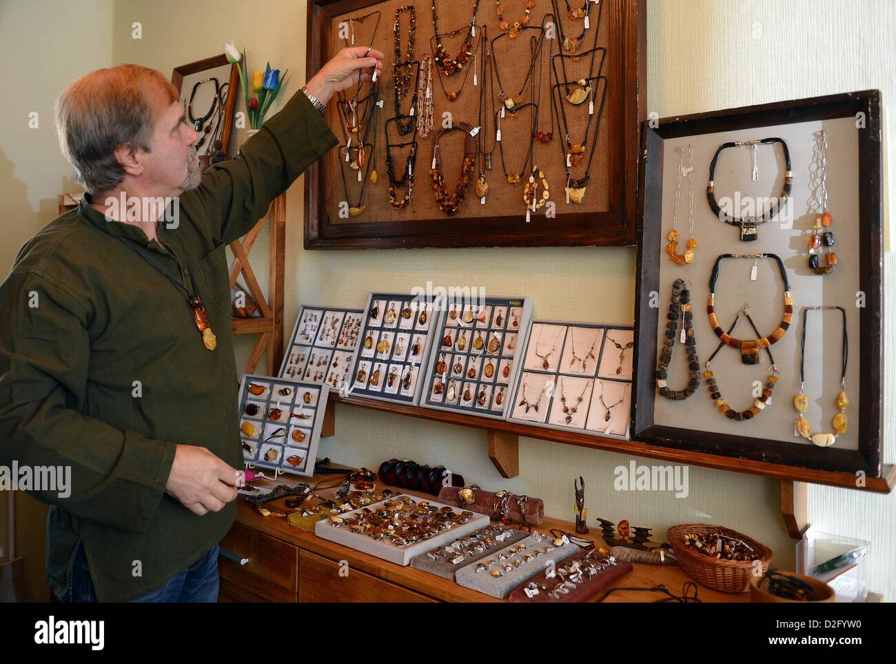 Amber Carver Gerald Jancke shows amber jewelry in his shop in Lychen ...