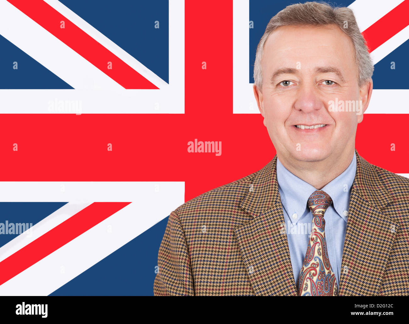 Portrait of smiling middle-aged businessman over British flag Stock ...