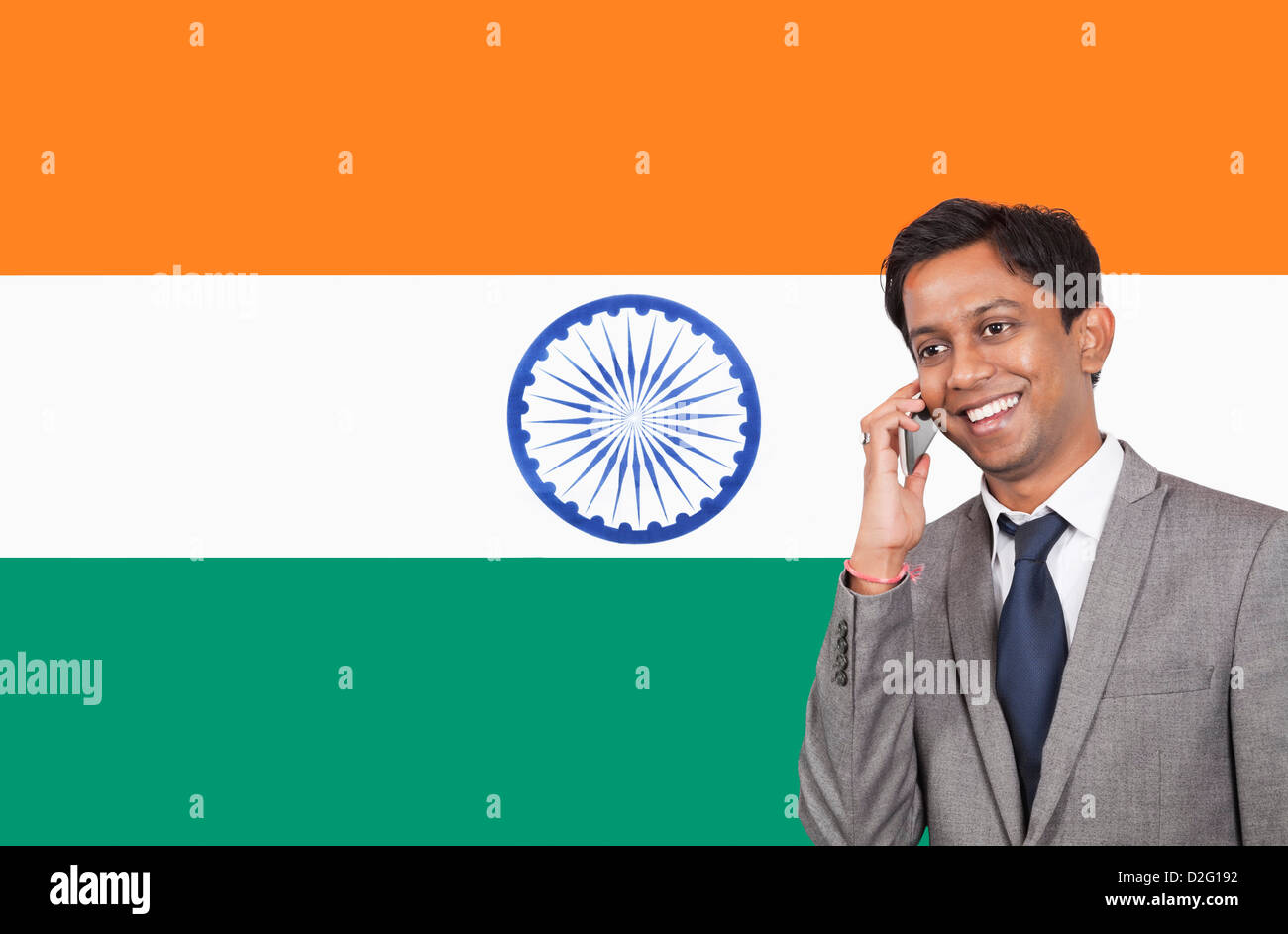 Young businessman using cell phone over Indian flag Stock Photo - Alamy