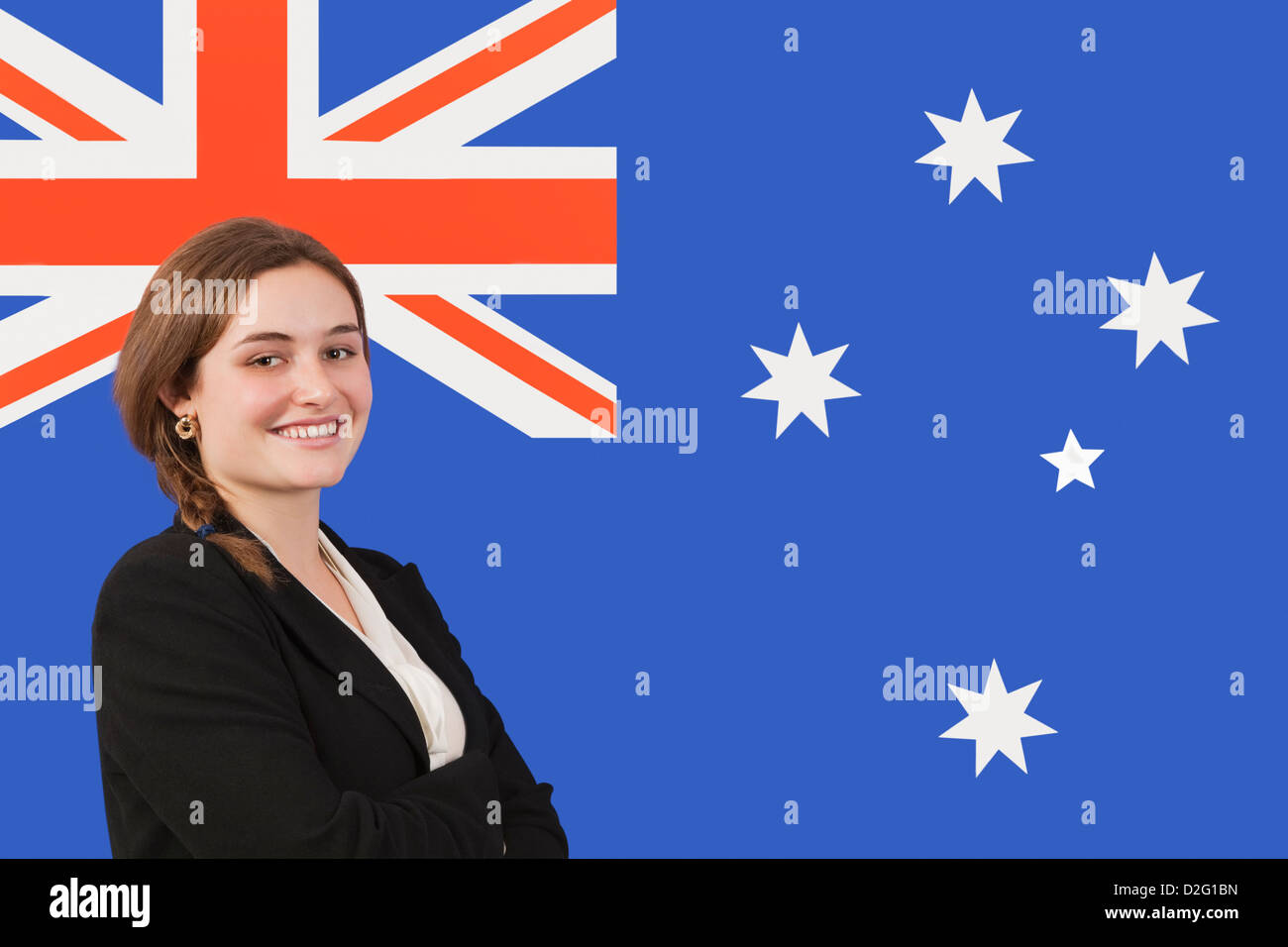 Portrait of young businesswoman smiling over Australian flag Stock ...