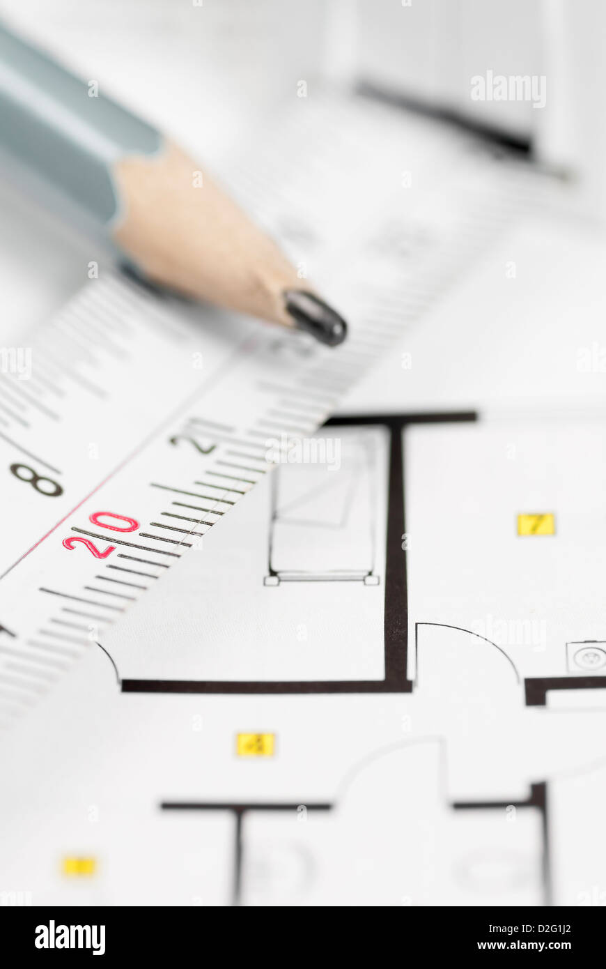 White tape measure on architect plans with pencil Stock Photo - Alamy