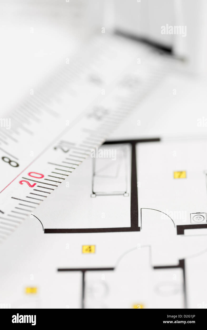White tape measure on architect plans Stock Photo - Alamy