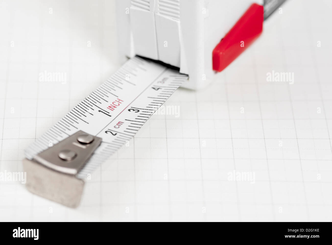 White tape measure on graph paper Stock Photo - Alamy