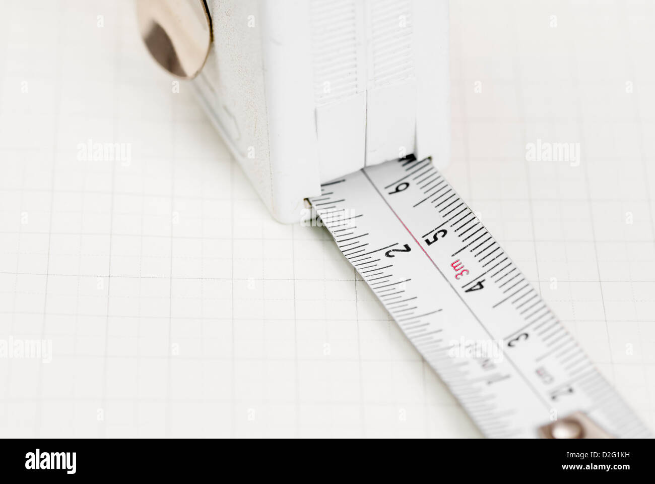 White tape measure on graph paper Stock Photo - Alamy