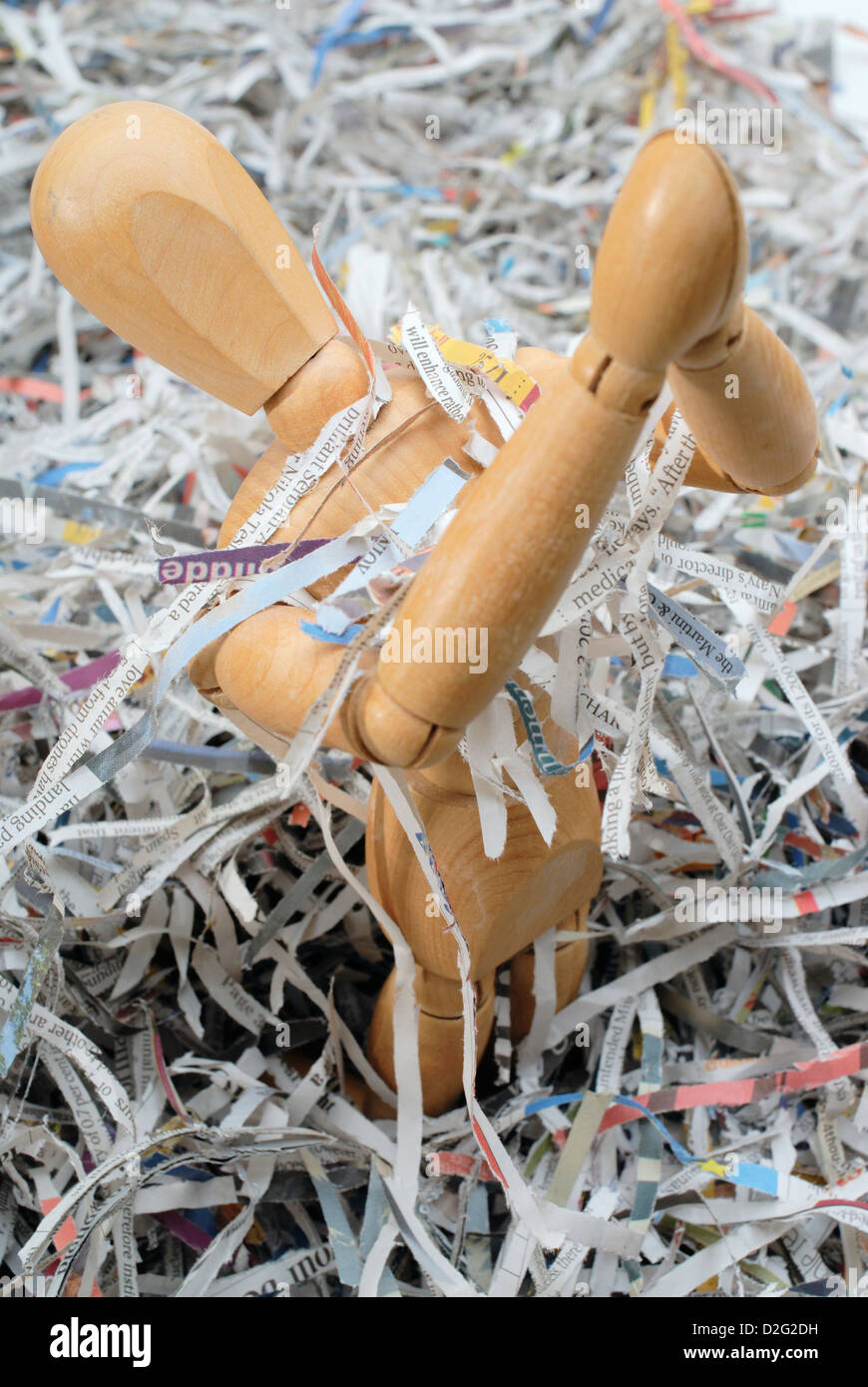 Shredded paper and wooden man Stock Photo - Alamy