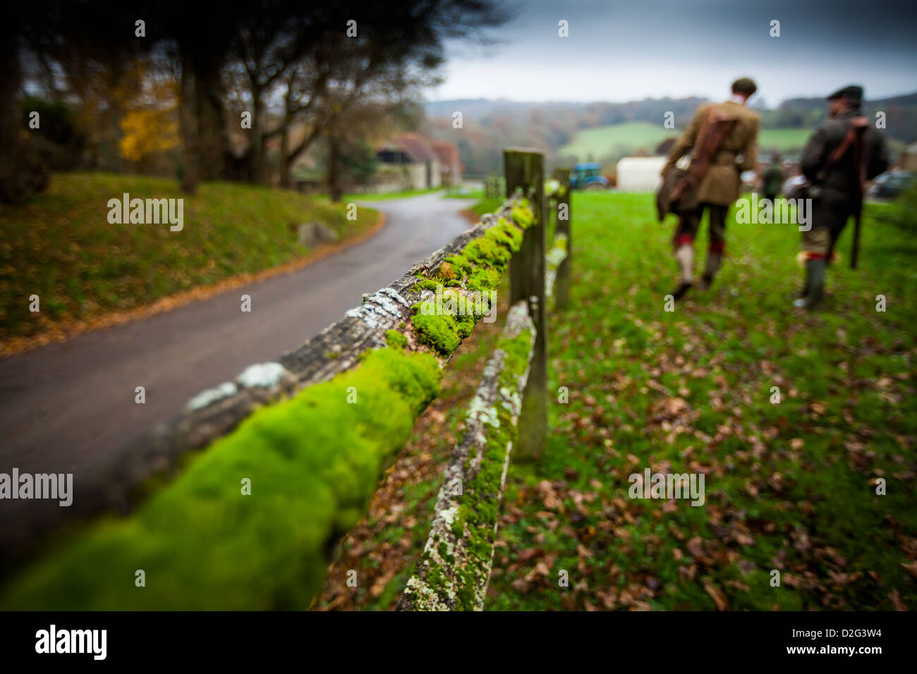 A photo of two male guns walking to the next drive on a shoot in Devon ...