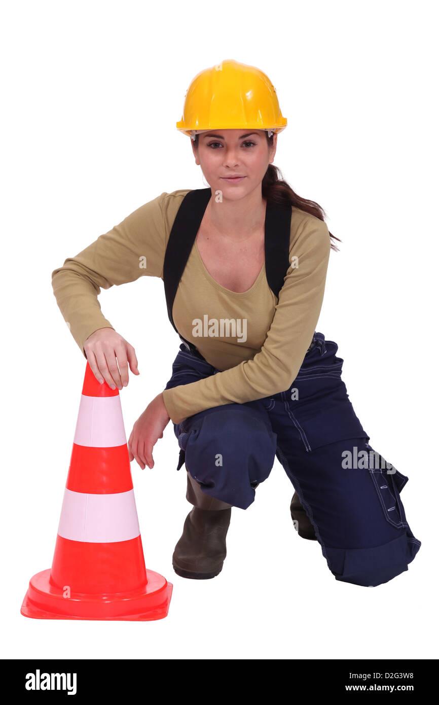 Woman with a traffic cone Stock Photo - Alamy