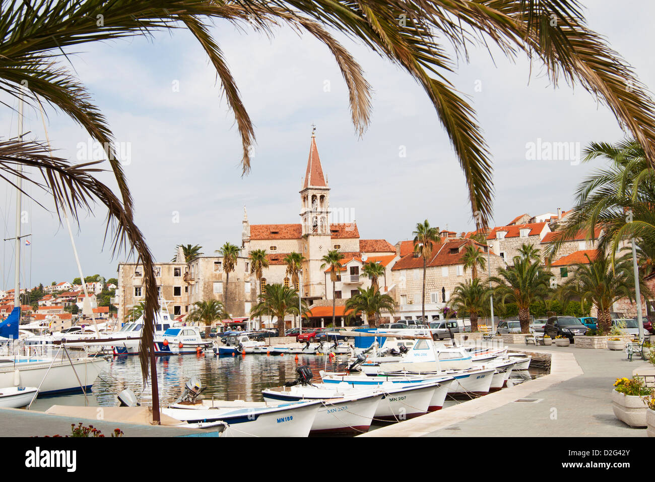 Milna town center and marina with boats moored along the harbor and ...