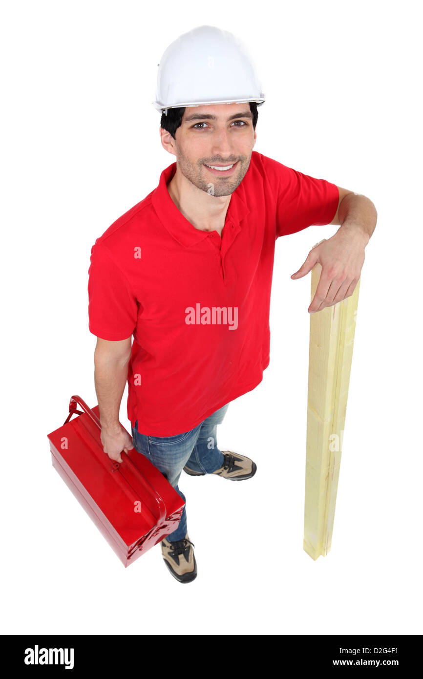Man holding tool-box and wooden planks Stock Photo - Alamy
