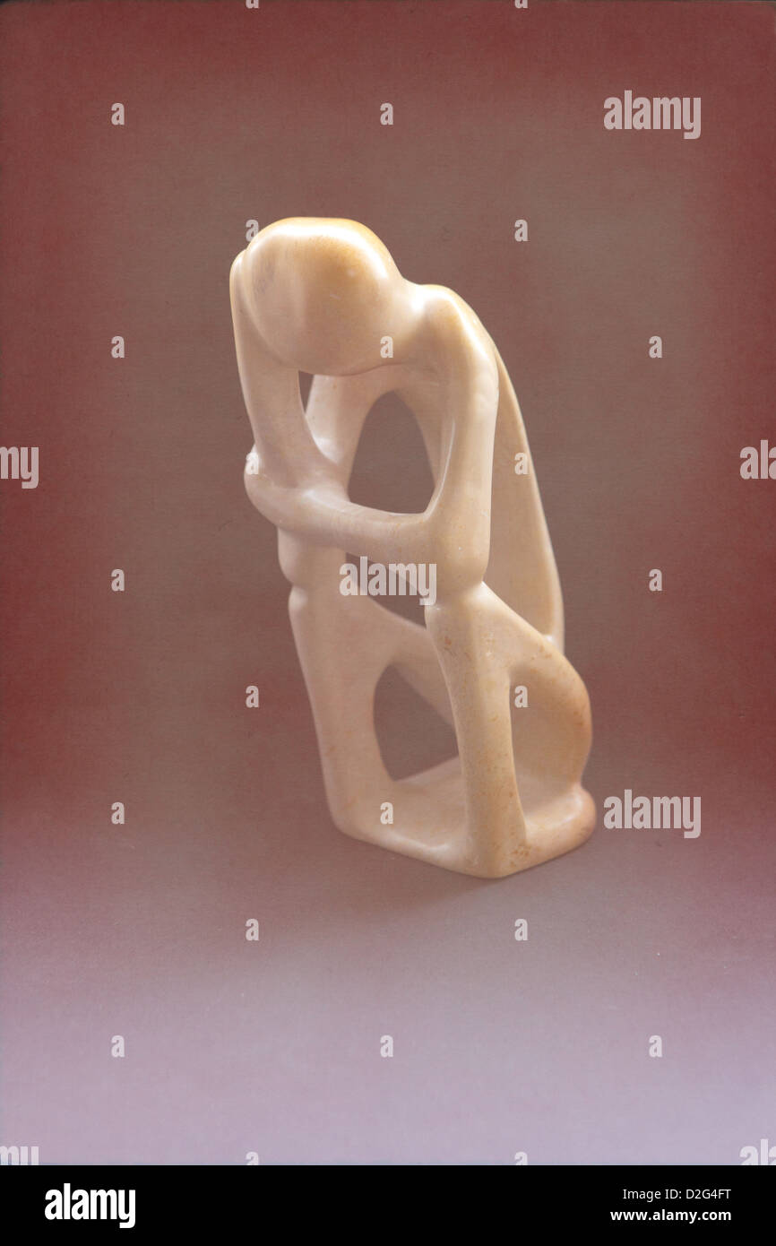 Creative still life image of a thinking man made of stone with paper ...