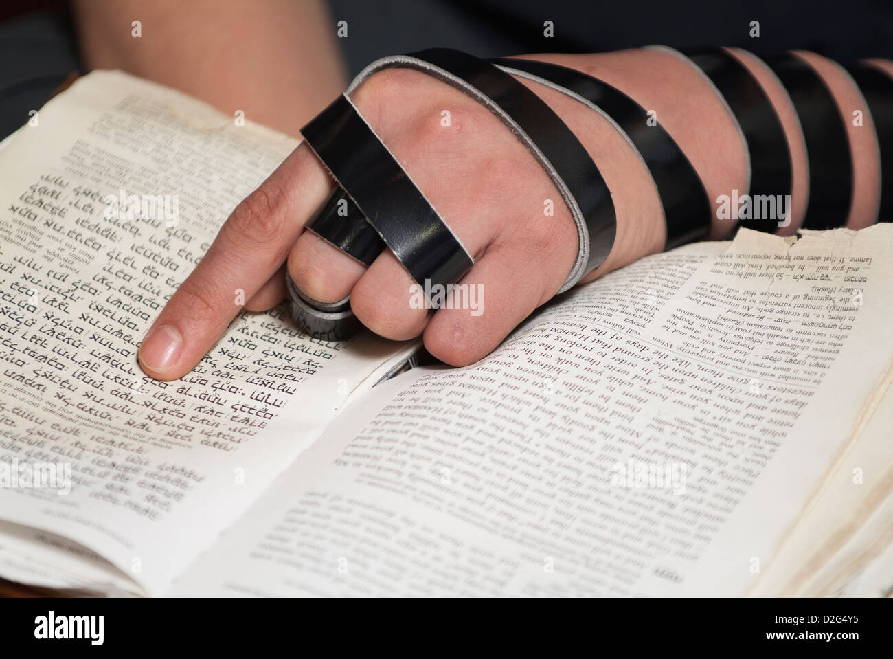 Close up photograph of boy, man wearing tefilim, tephilim holding an ...