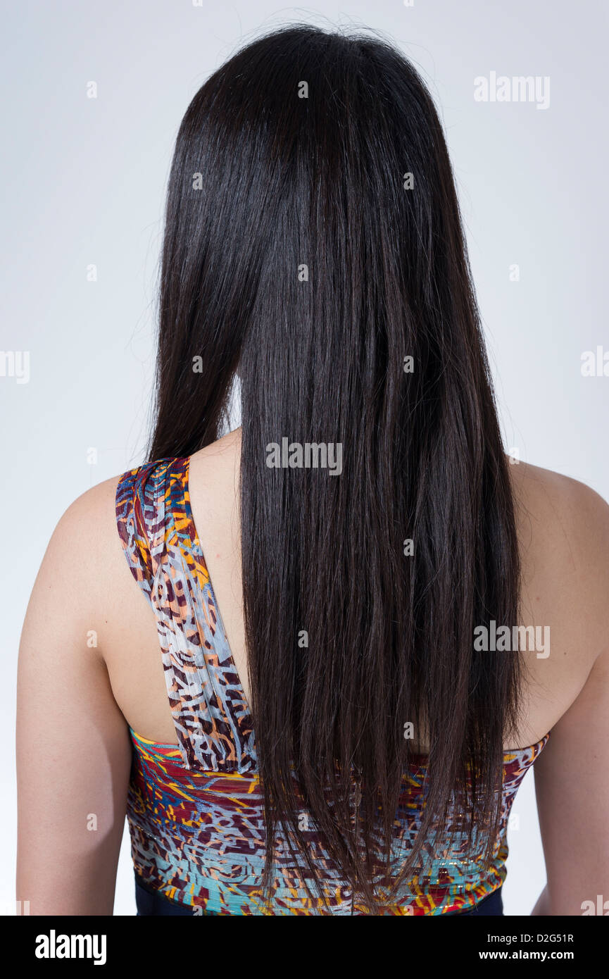Rear shot, back view of oriental woman, girl with long black brown hair ...
