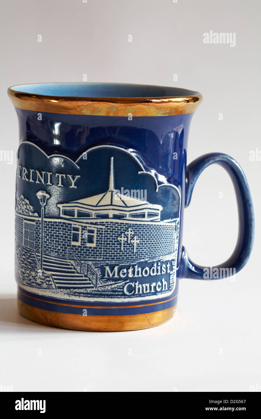 blue gold rimmed mug of Trinity Methodist Church isolated on white ...