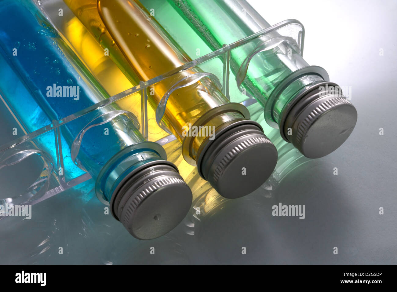 Test tubes with a dark blue, green and yellow liquid Stock Photo - Alamy